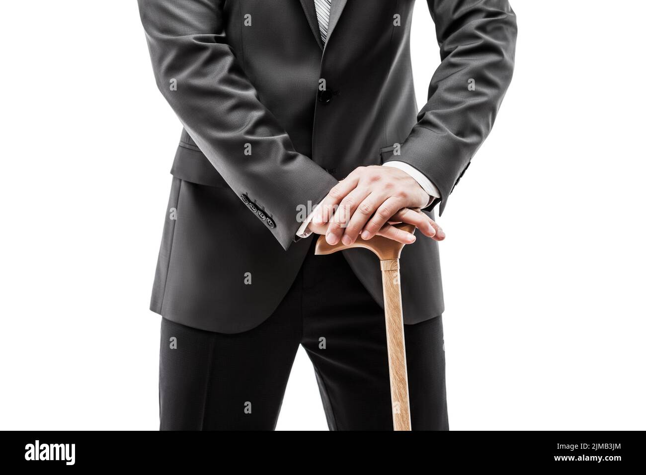 Businessman in black suit holding walking cane stick Stock Photo - Alamy