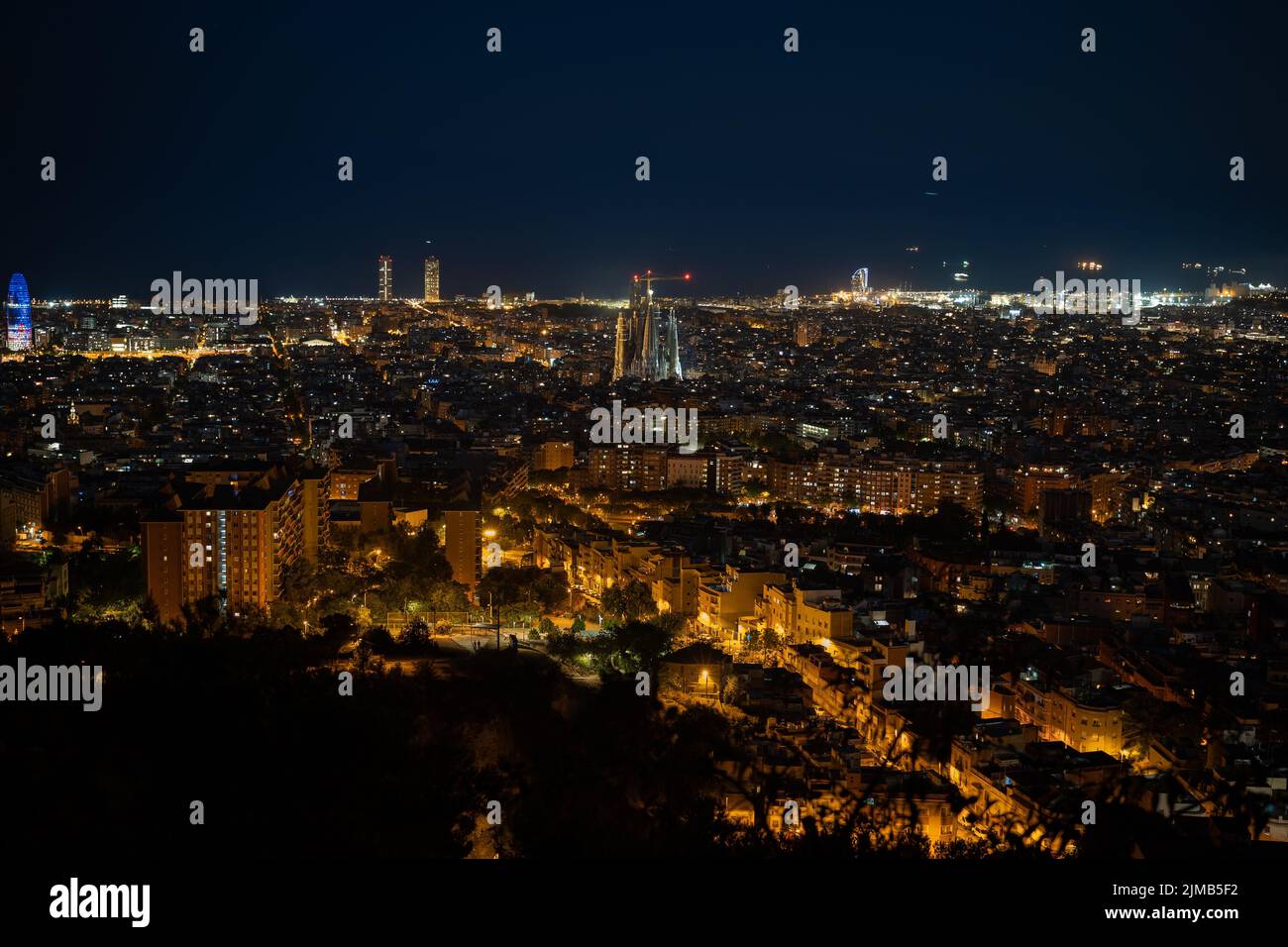 A night city beautiful panorama with street and houses burning lights ...