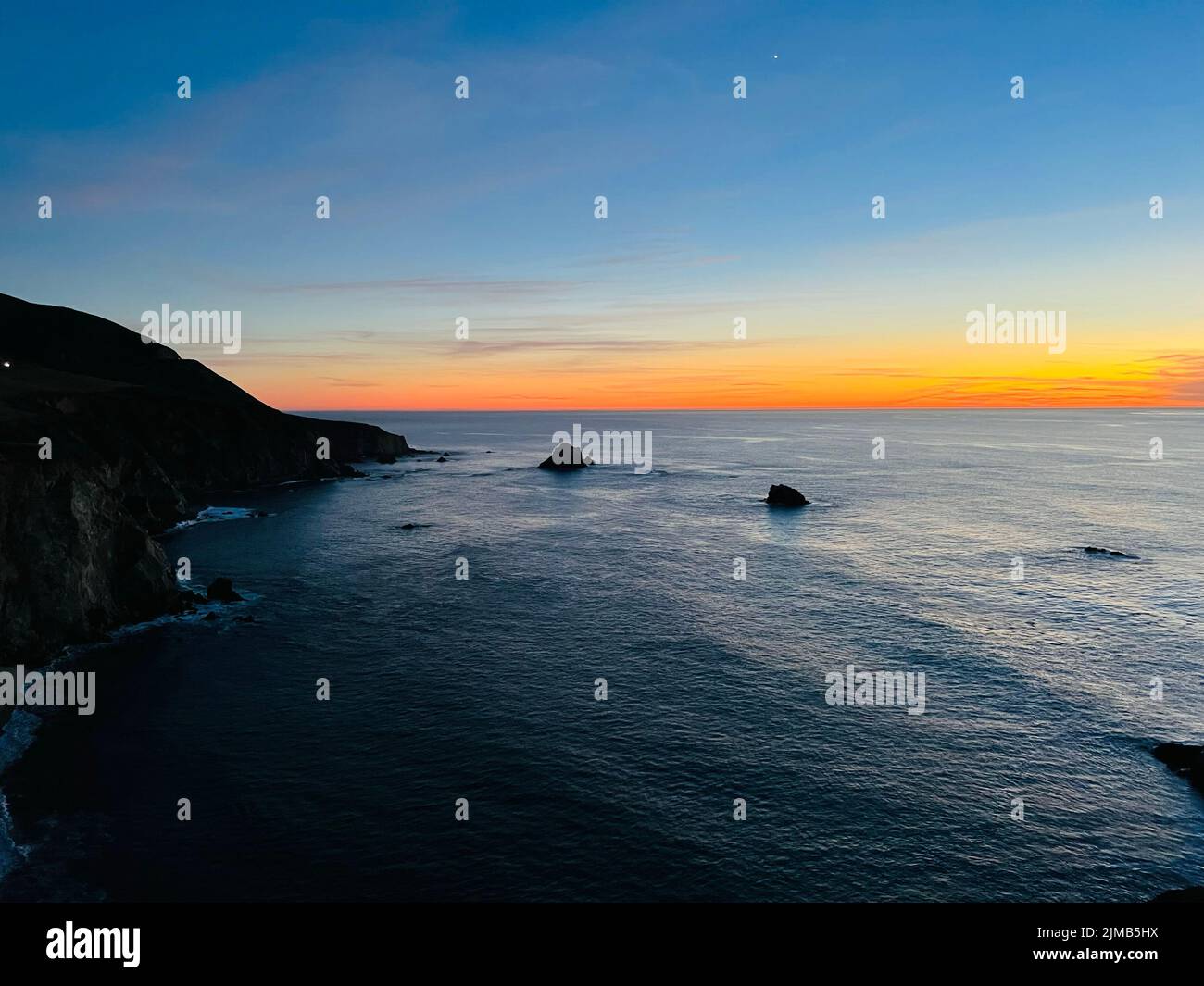 A mesmerizing view of the golden sunset over the sea Stock Photo - Alamy