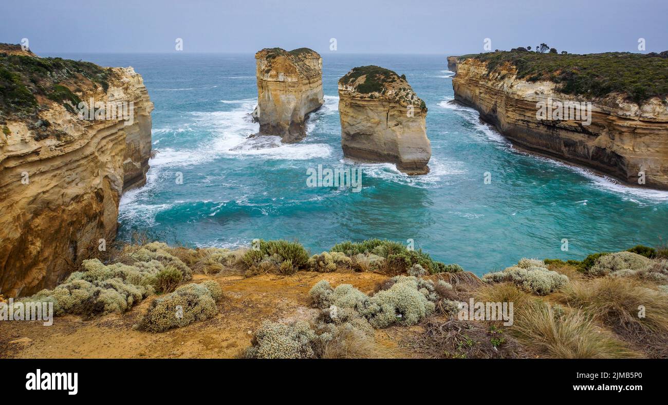 A seascape of large rock pinnacles in the ocean at Twelve Apostles ...