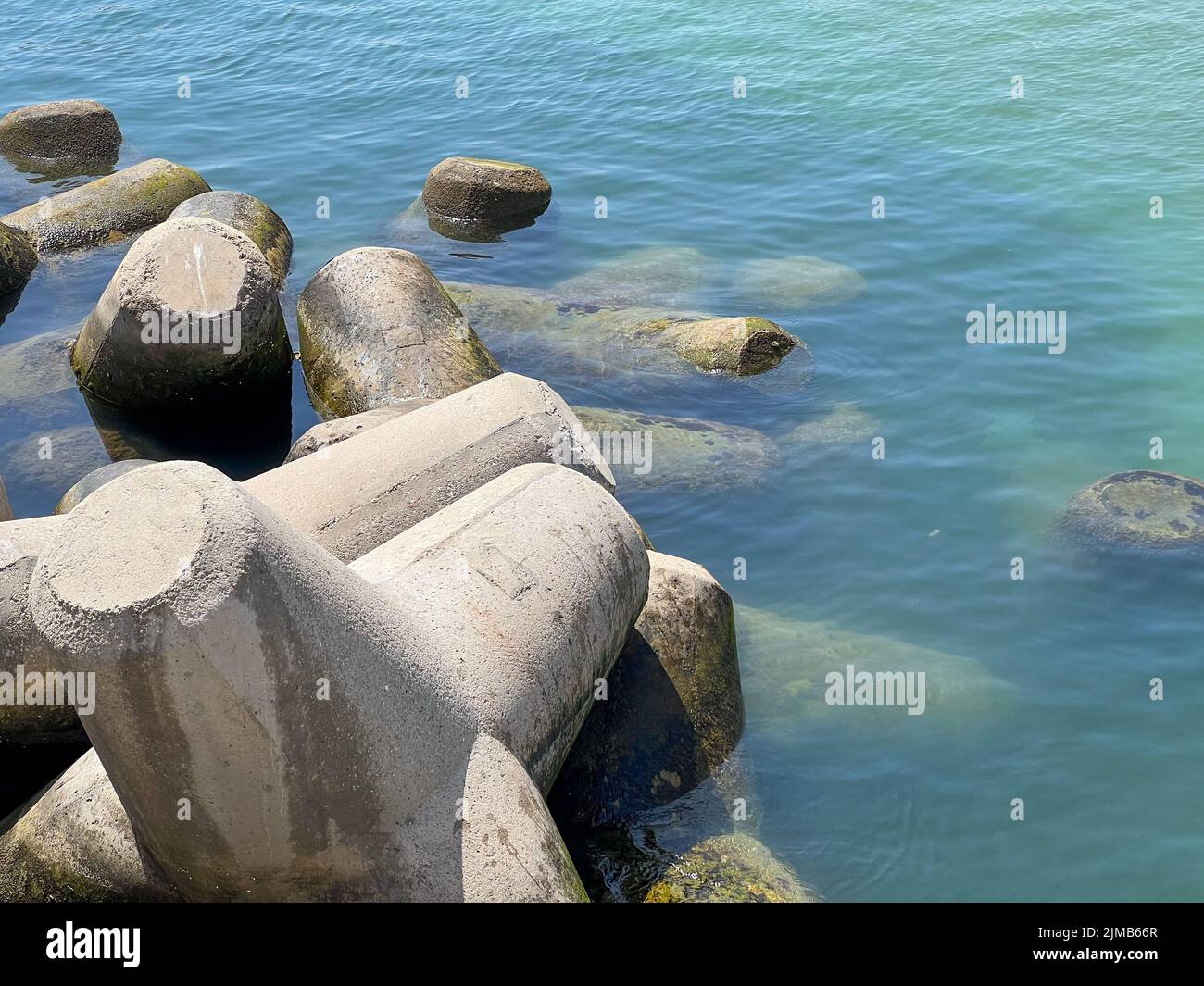 Waves break concrete breakwaters hi-res stock photography and images ...