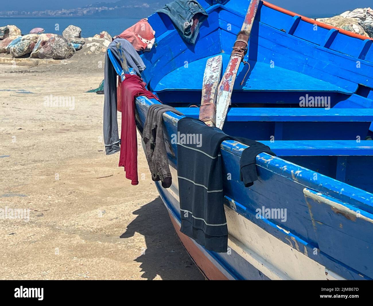 Laundry clothes hanging on a fishing boat Stock Photo - Alamy