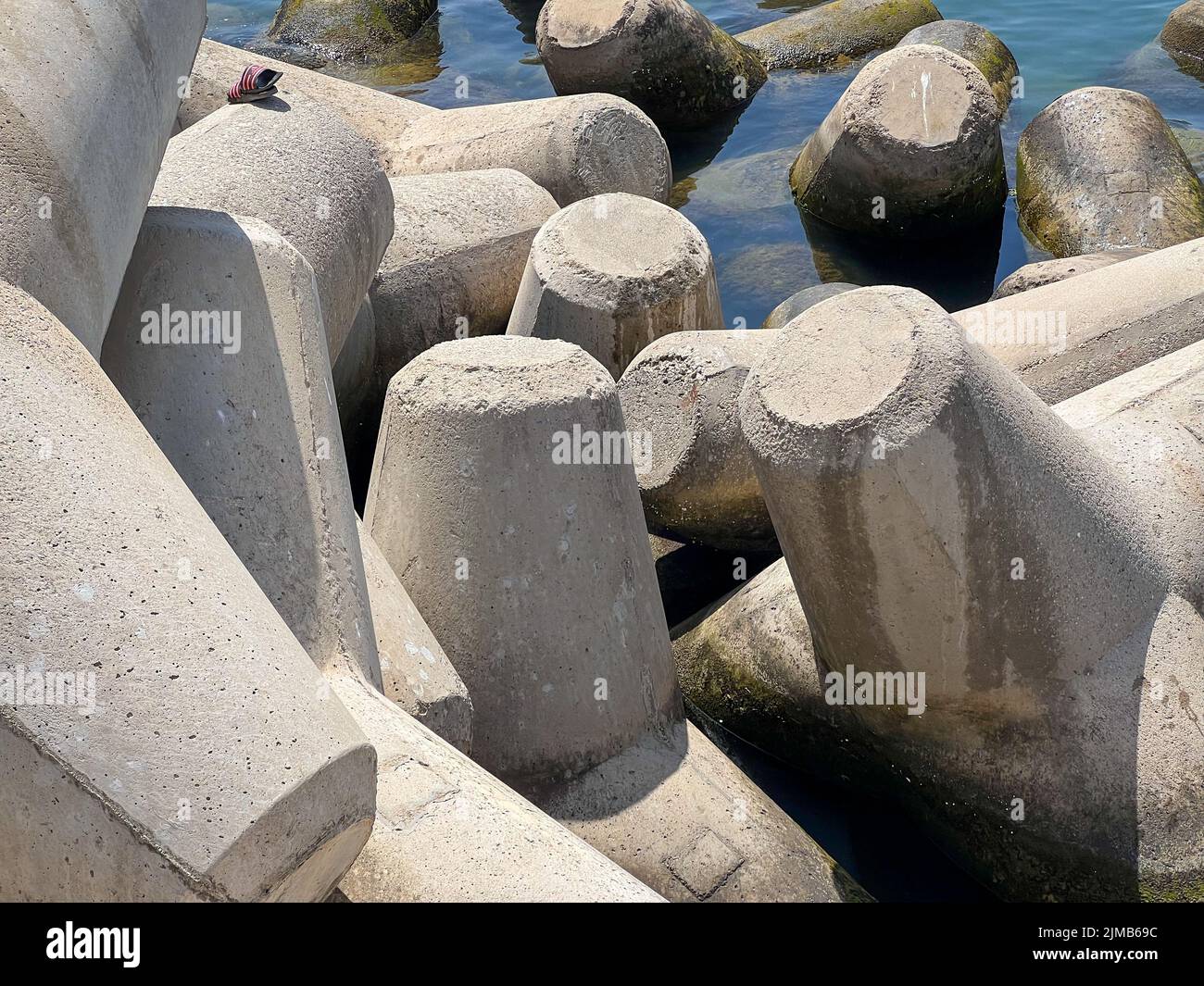 Waves break concrete breakwaters hi-res stock photography and images ...
