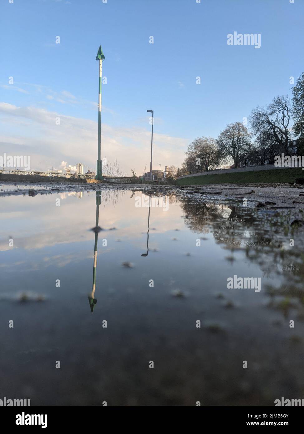 Reflection Mirror on the water of a dock road Stock Photo - Alamy