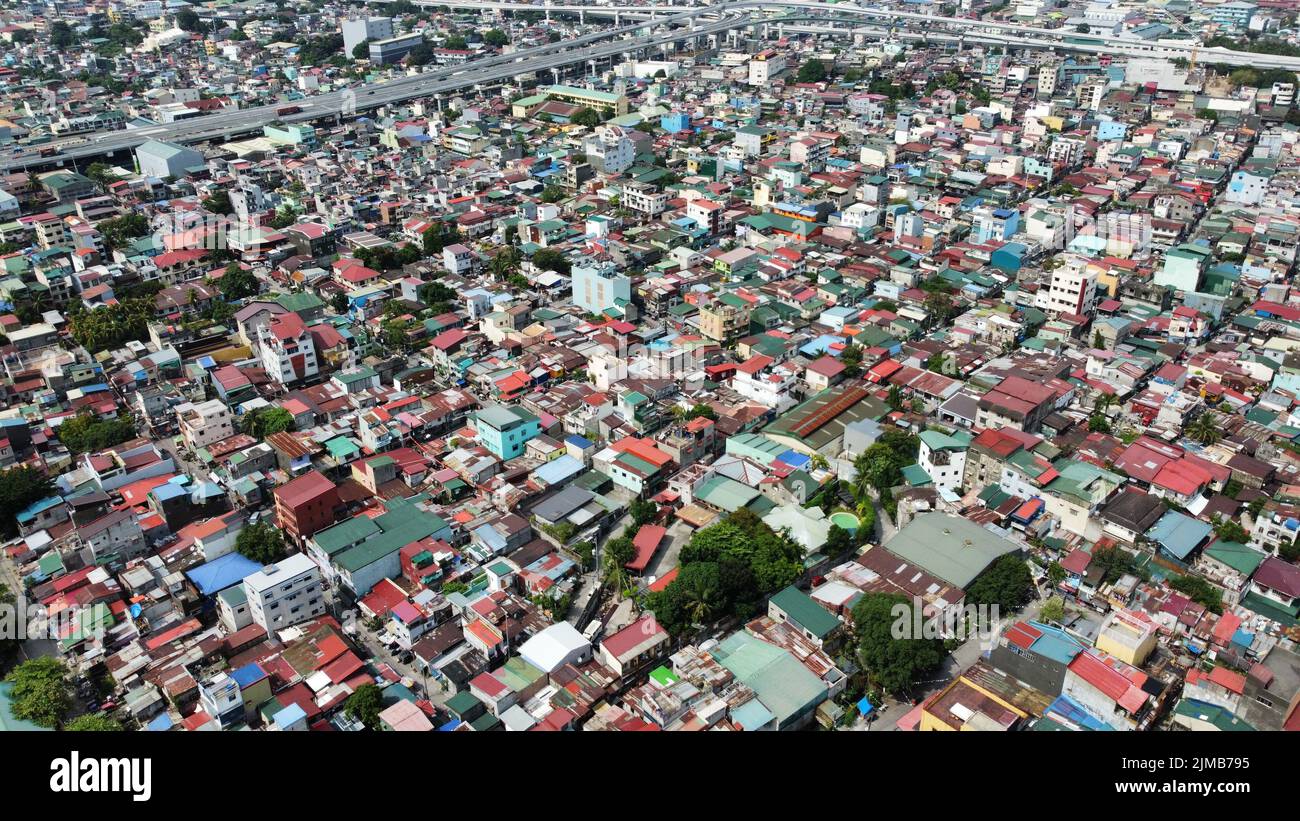 The aerial view over the colorful buildings in a dense residential area ...