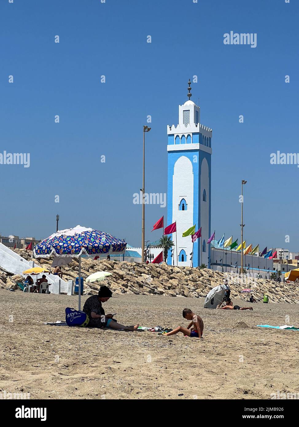 Crowd of people enjoying their summer holiday on the beach Stock Photo ...