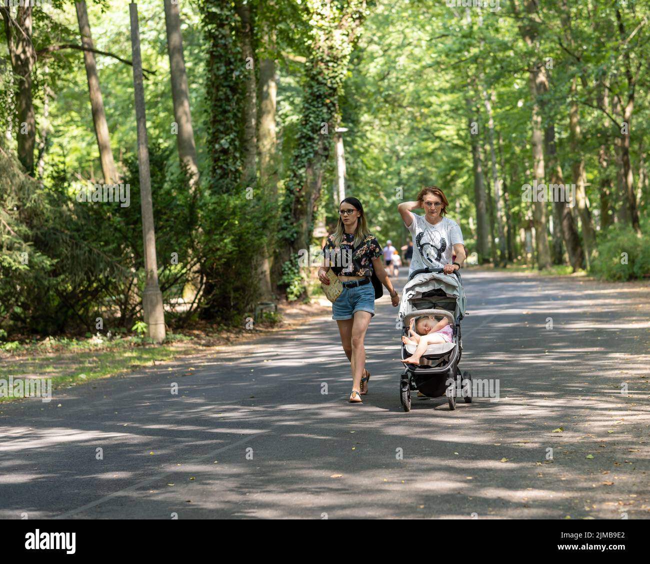 Two women child buggy hi-res stock photography and images - Alamy