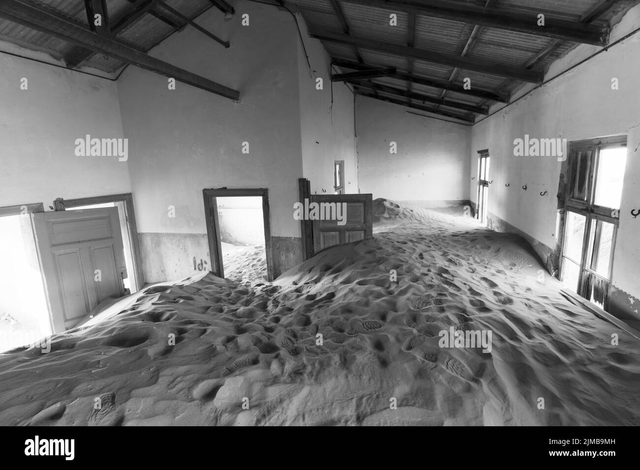 abandoned diamond mine at Kolmanskop, showing buildings invaded by sand ...
