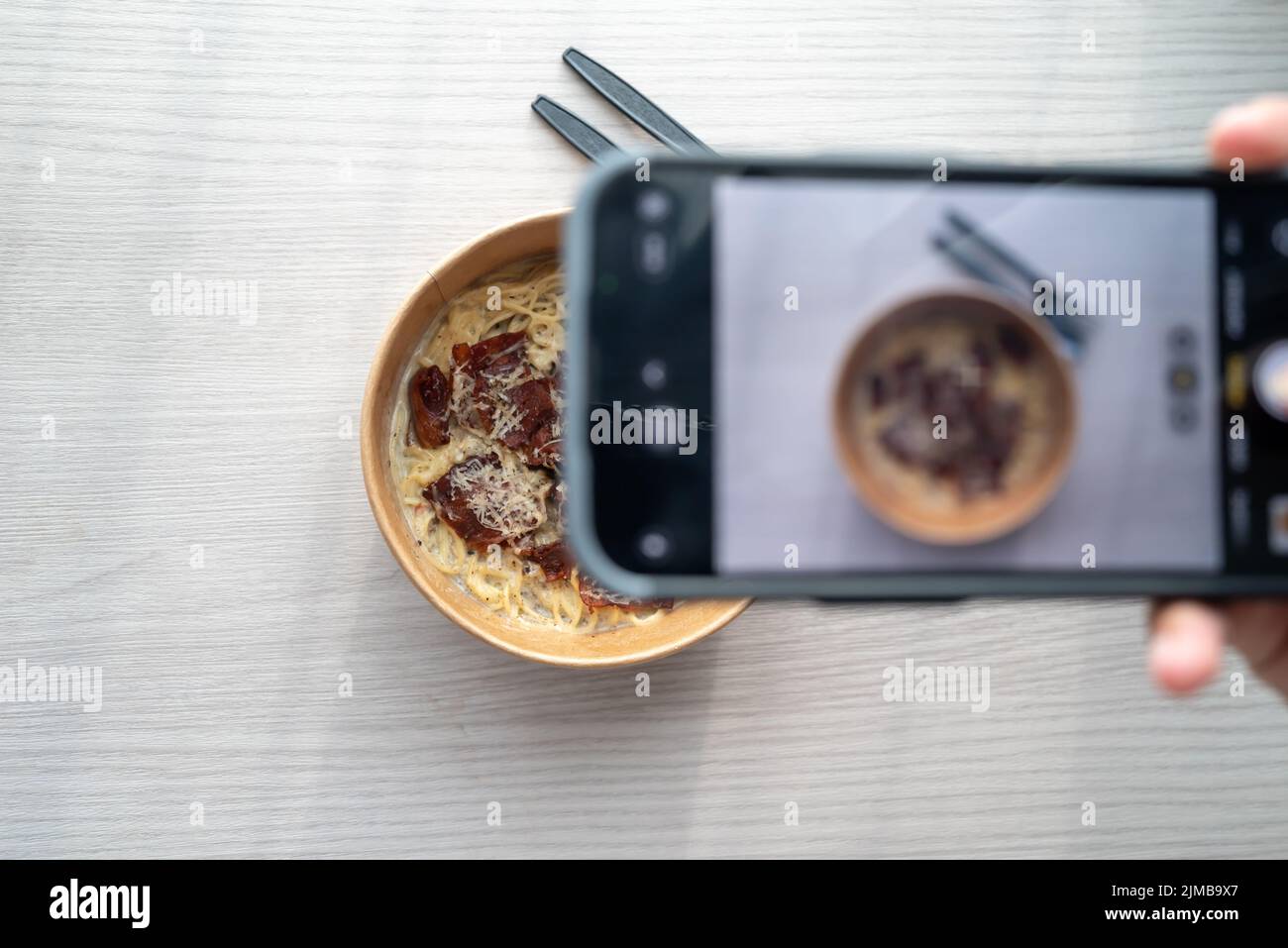 Shoot first eat later concept, shooting truffle white sauce pasta top ...