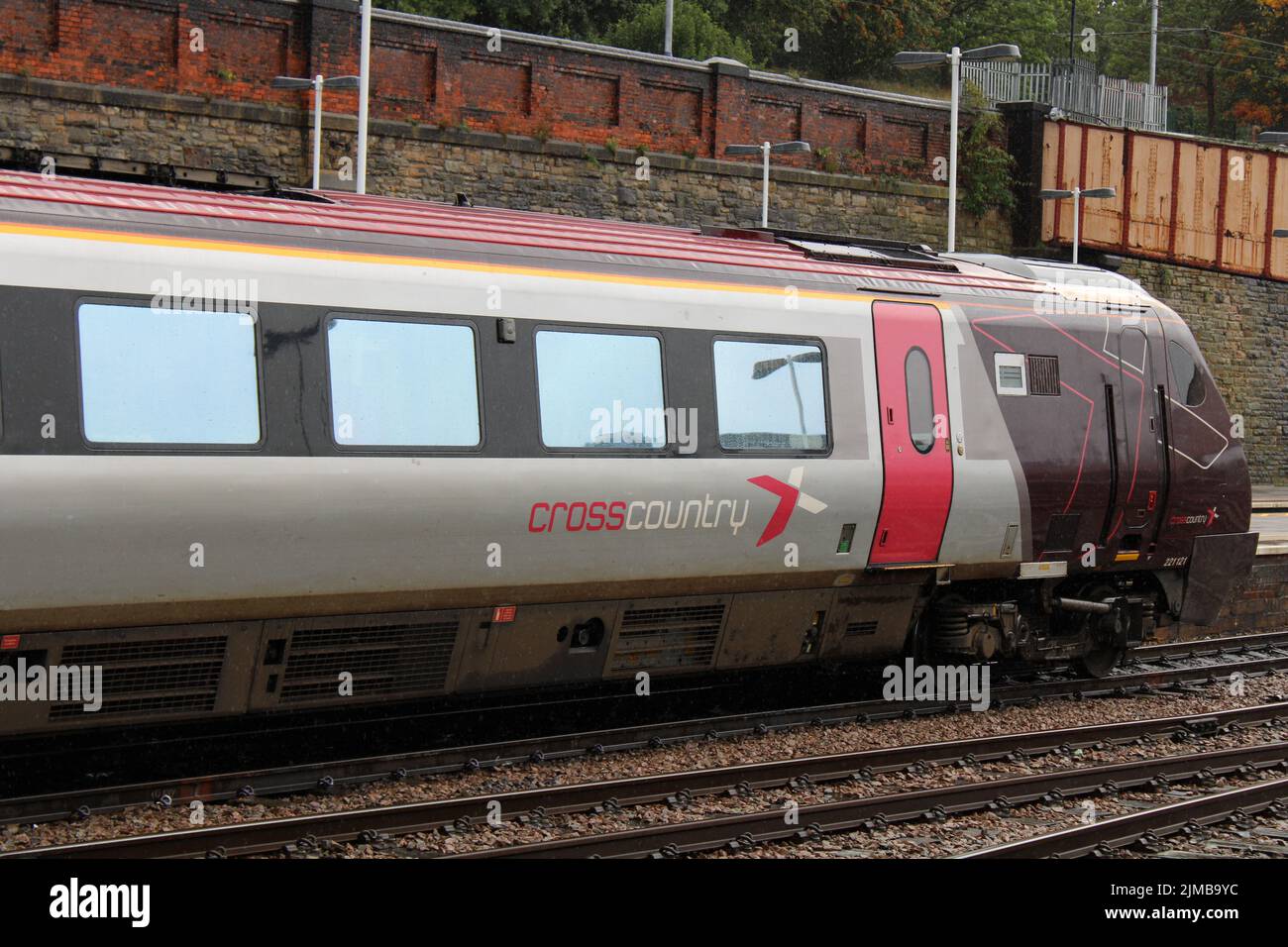 A closeup shot of a CrossCountry train departing from a railway station ...