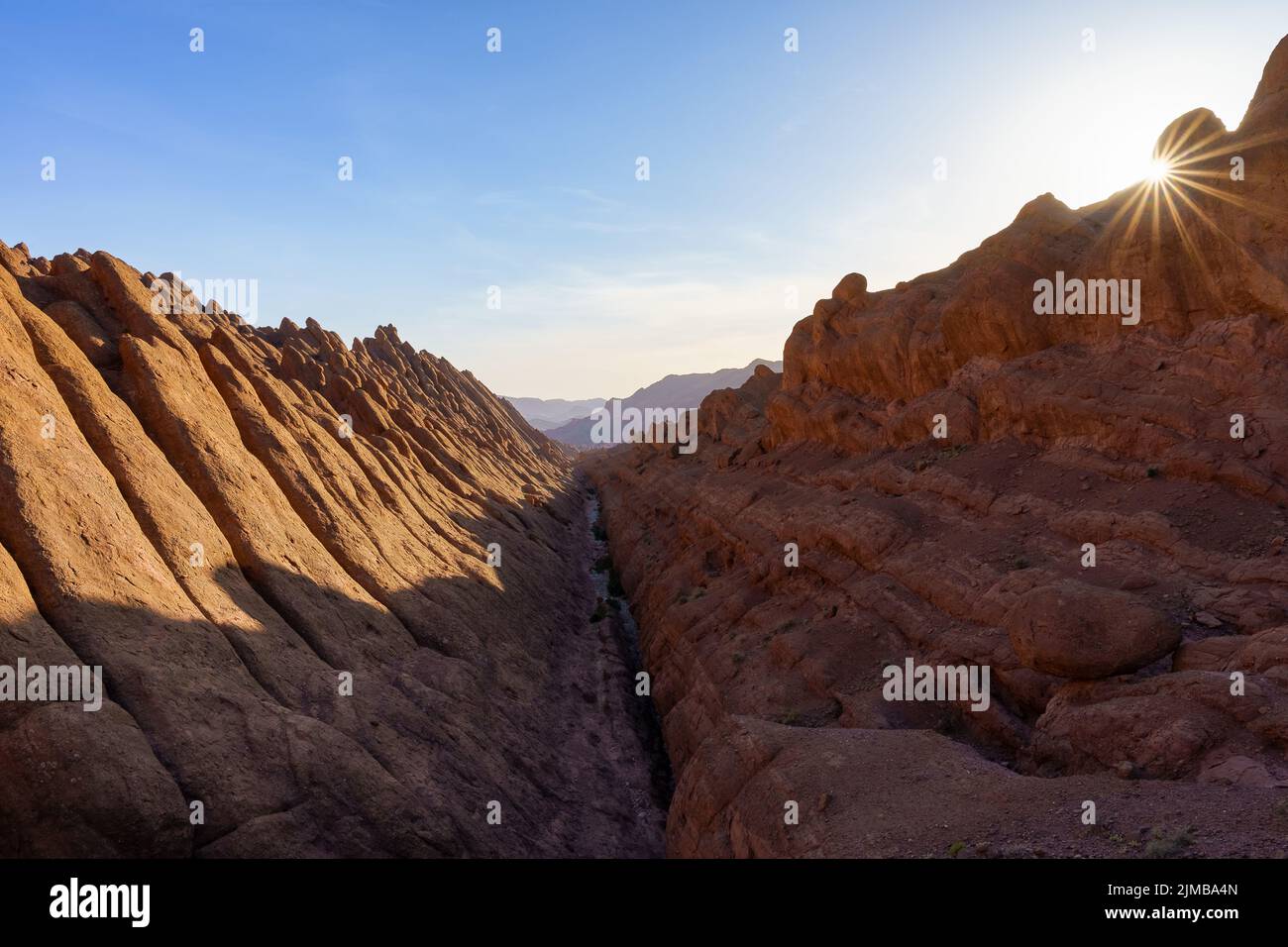The bright sun in blue sky shining over the Dades Gorges in Morocco ...