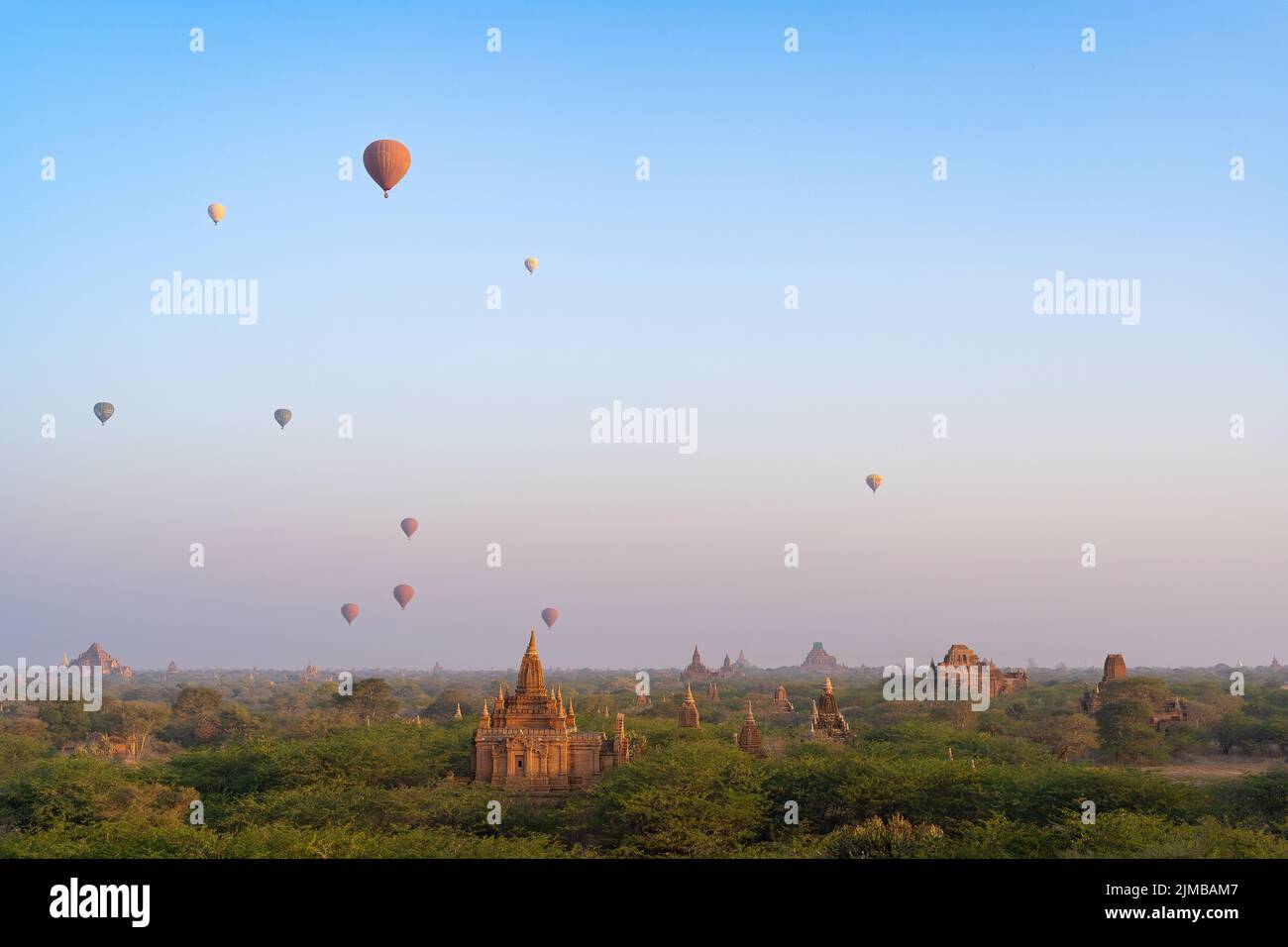 A scenic sunrise with hot air balloons in Old Bagan, Myanmar (Burma ...