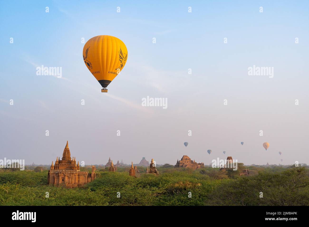 A scenic sunrise with hot air balloons in Old Bagan, Myanmar (Burma ...