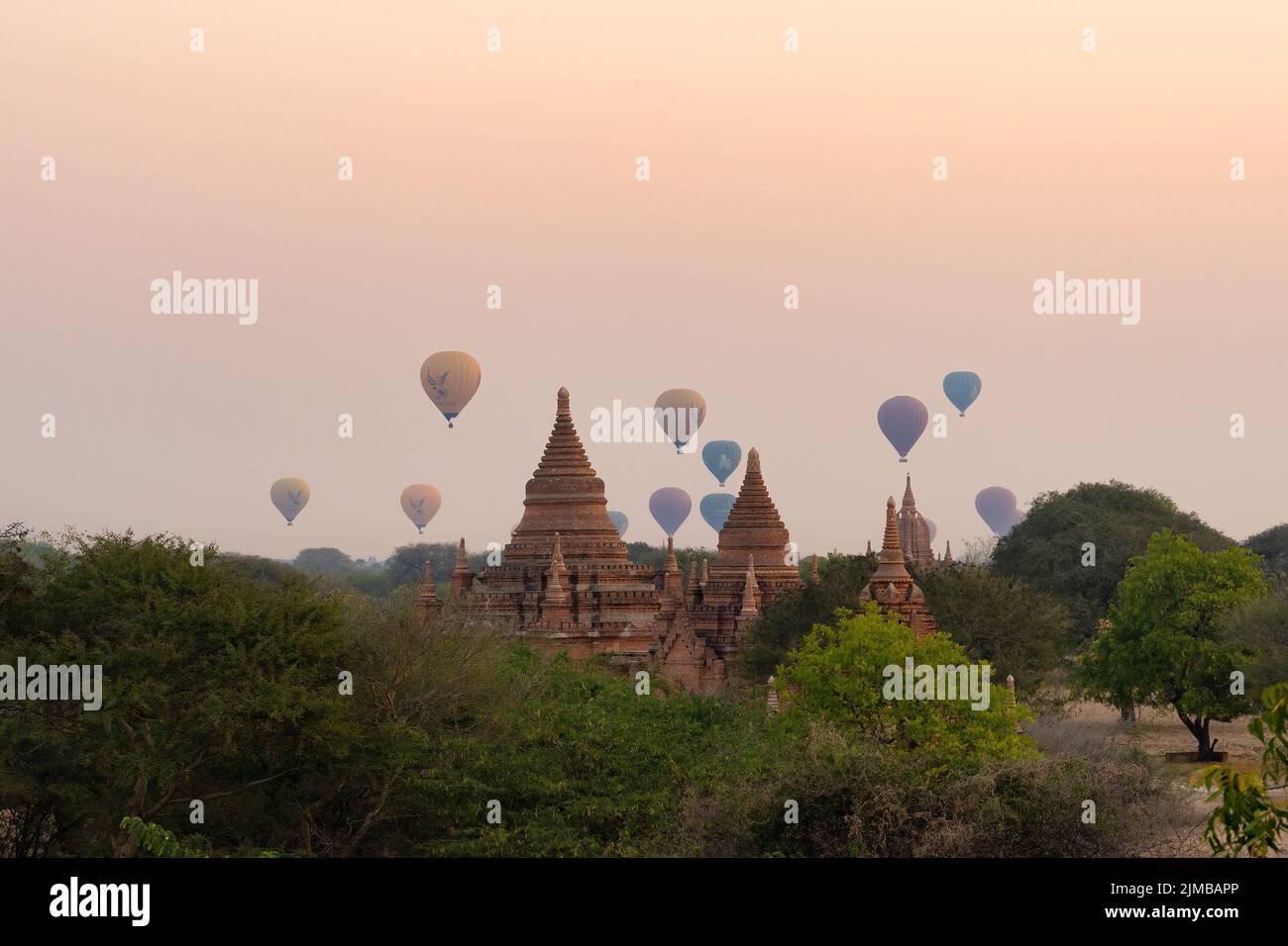A scenic sunrise with hot air balloons in Old Bagan, Myanmar (Burma ...