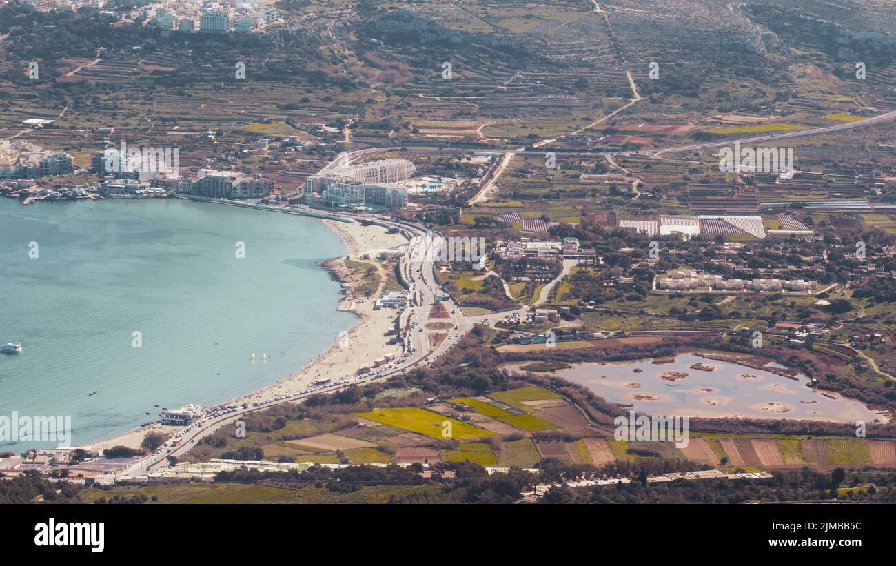 An aerial view of buildings on the shore in Ghadira Bay, Mellieha ...