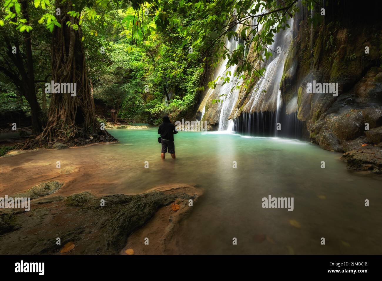 A person standing in the water at the beautiful Batlag falls in Tanay ...