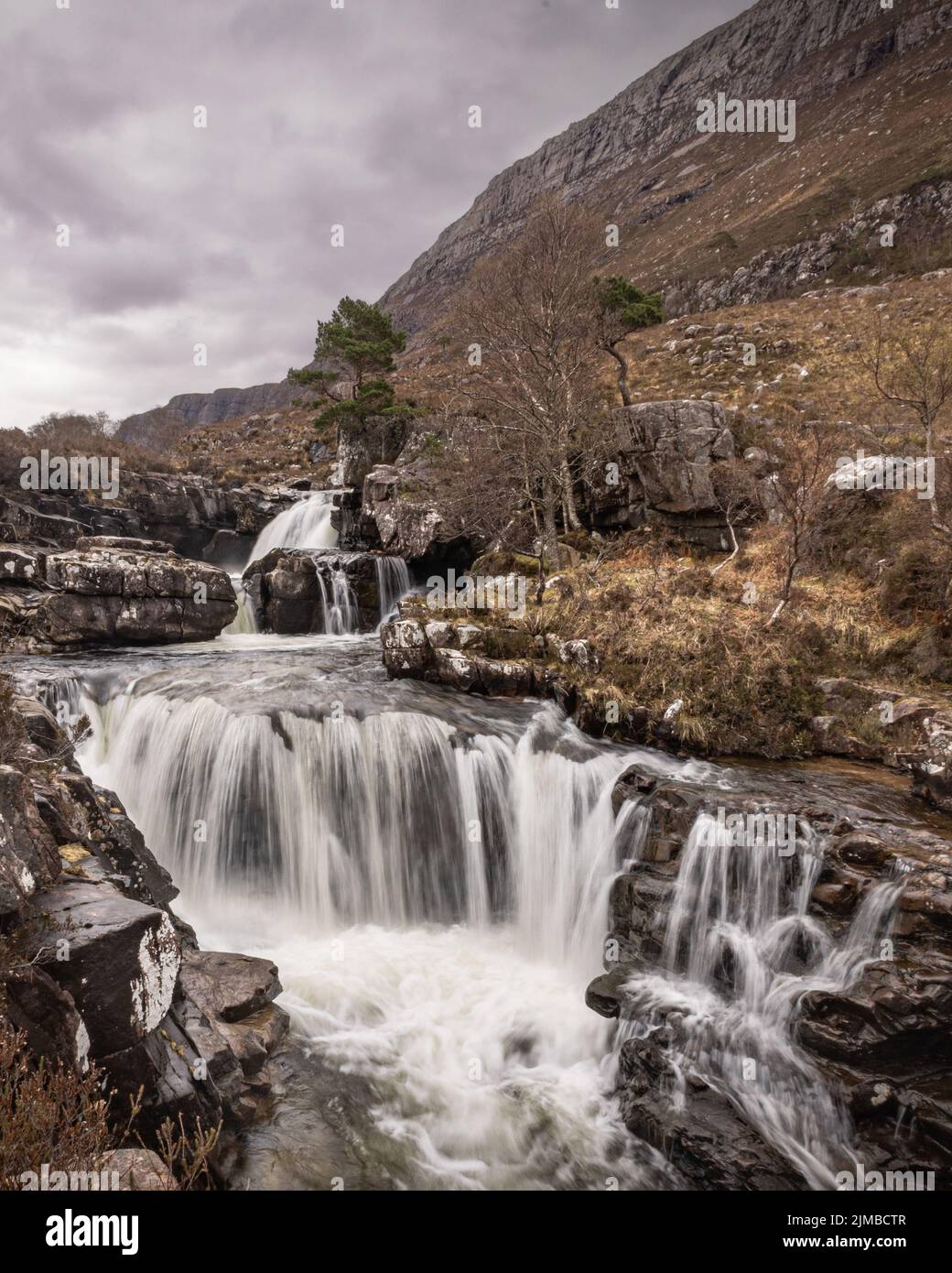 A dramatic long exposure of a mountain waterfall in the Scottish ...