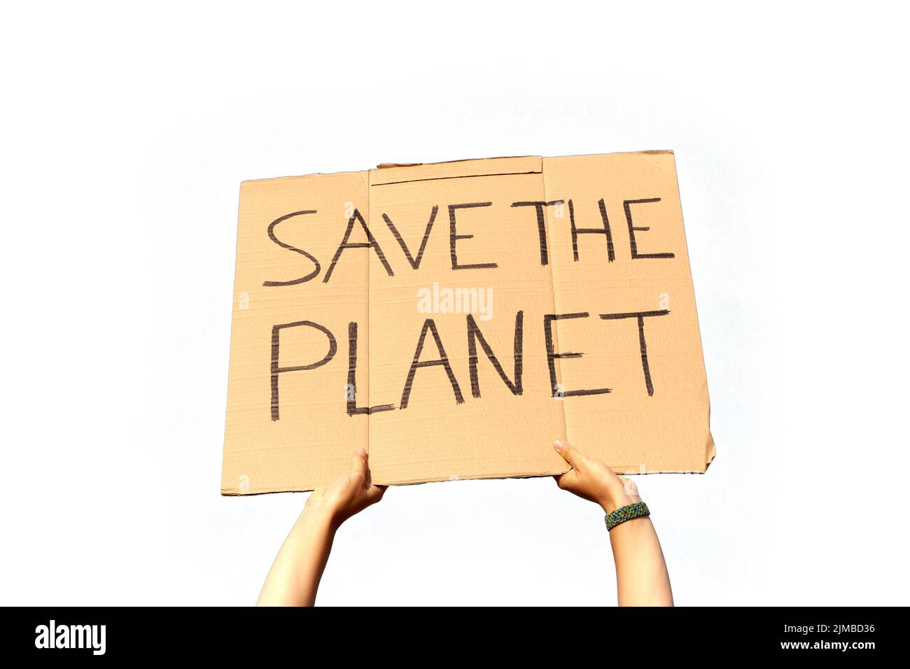 A Cardboard Signs saying Save the Planet held by two hands on a white ...