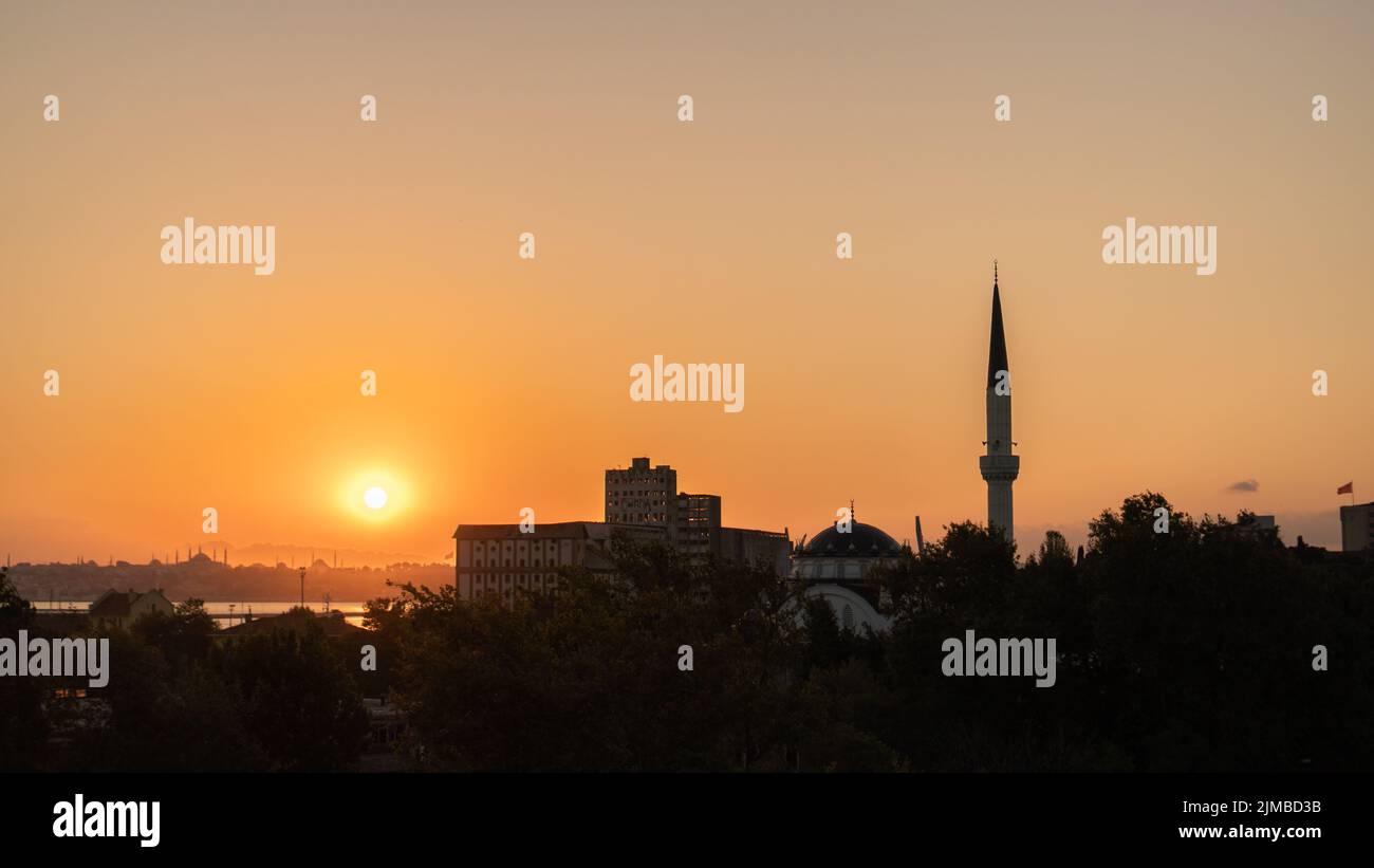 A beautiful scenery of a vibrant sunset over the city of Istanbul ...