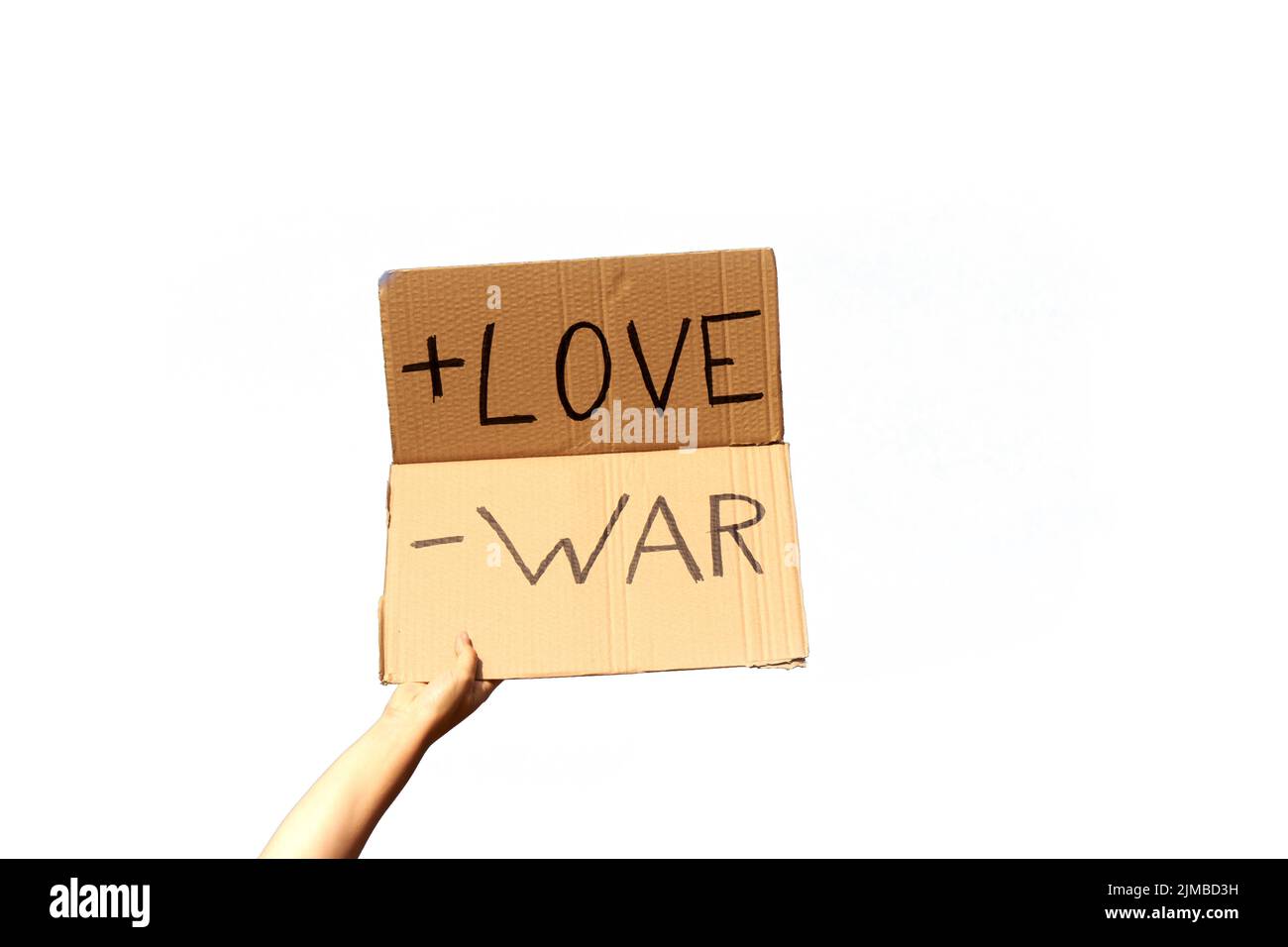 A Cardboard Signs saying More Love, Less War held by hands on a white ... A Cardboard Signs saying More Love, Less War held by hands on a white ...