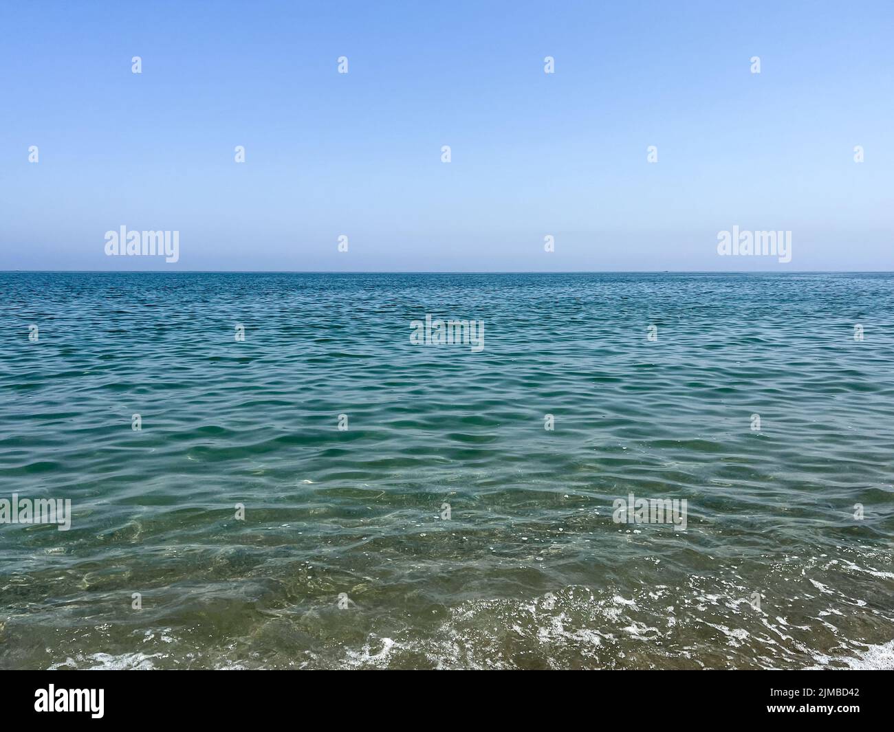 Transparent sea water surface on the shoreline Stock Photo - Alamy