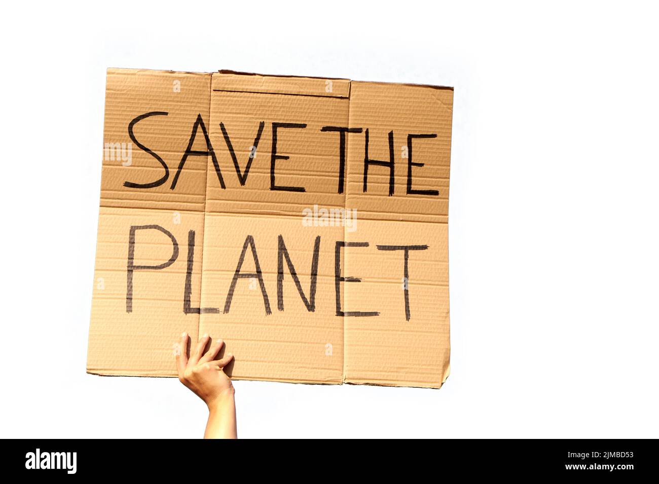 A Cardboard Signs saying Save the Planet held by two hands on a white ...