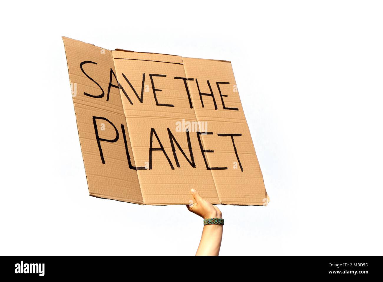 A Cardboard Signs saying "Save the Planet held by two hands on a white ...