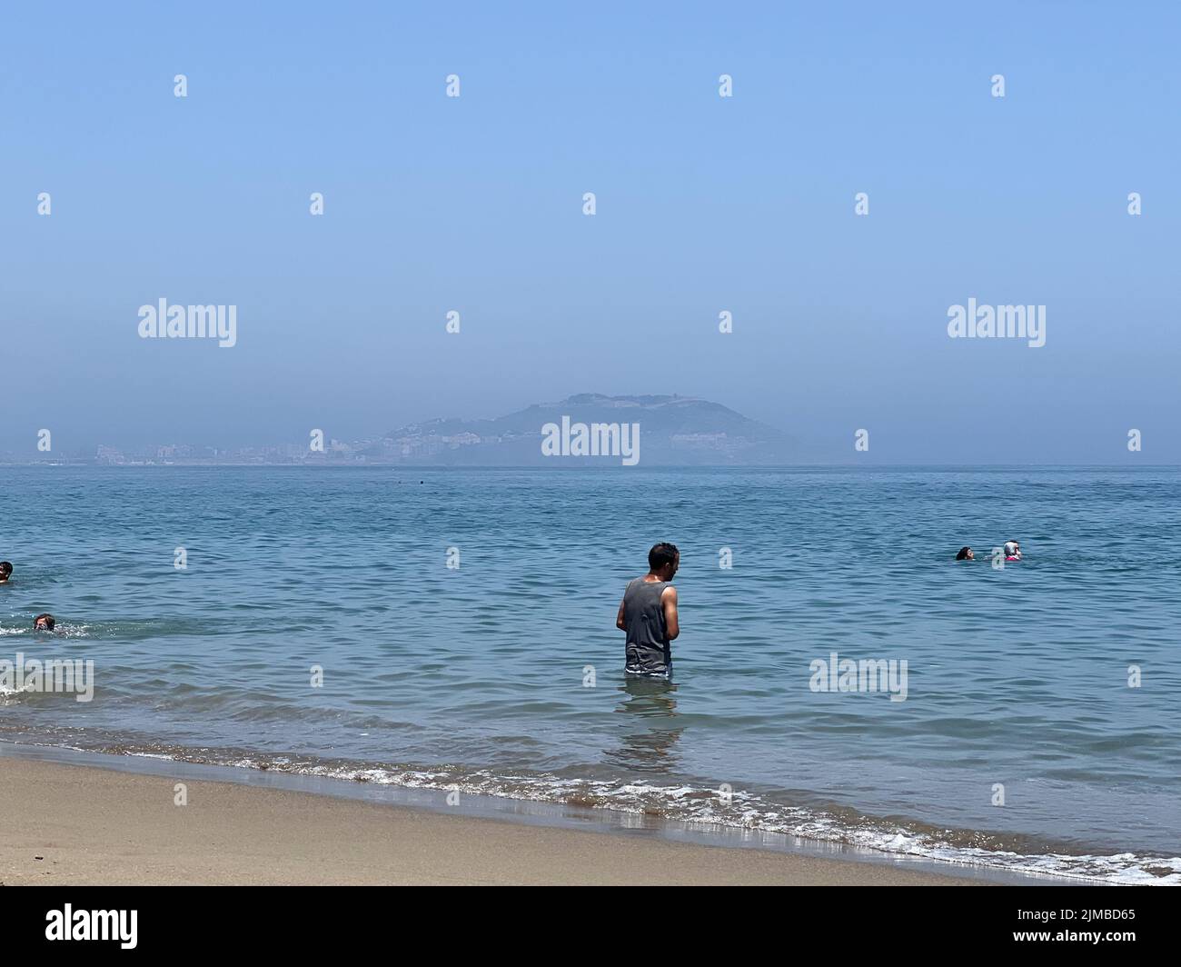 A man standing on the seaside Stock Photo - Alamy