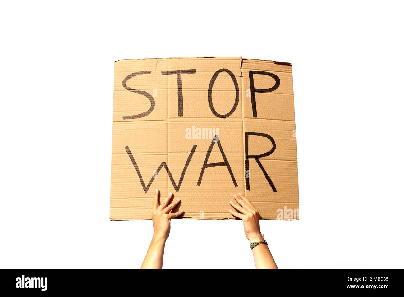 A Cardboard Signs saying Stop War held by hands on a white background ...