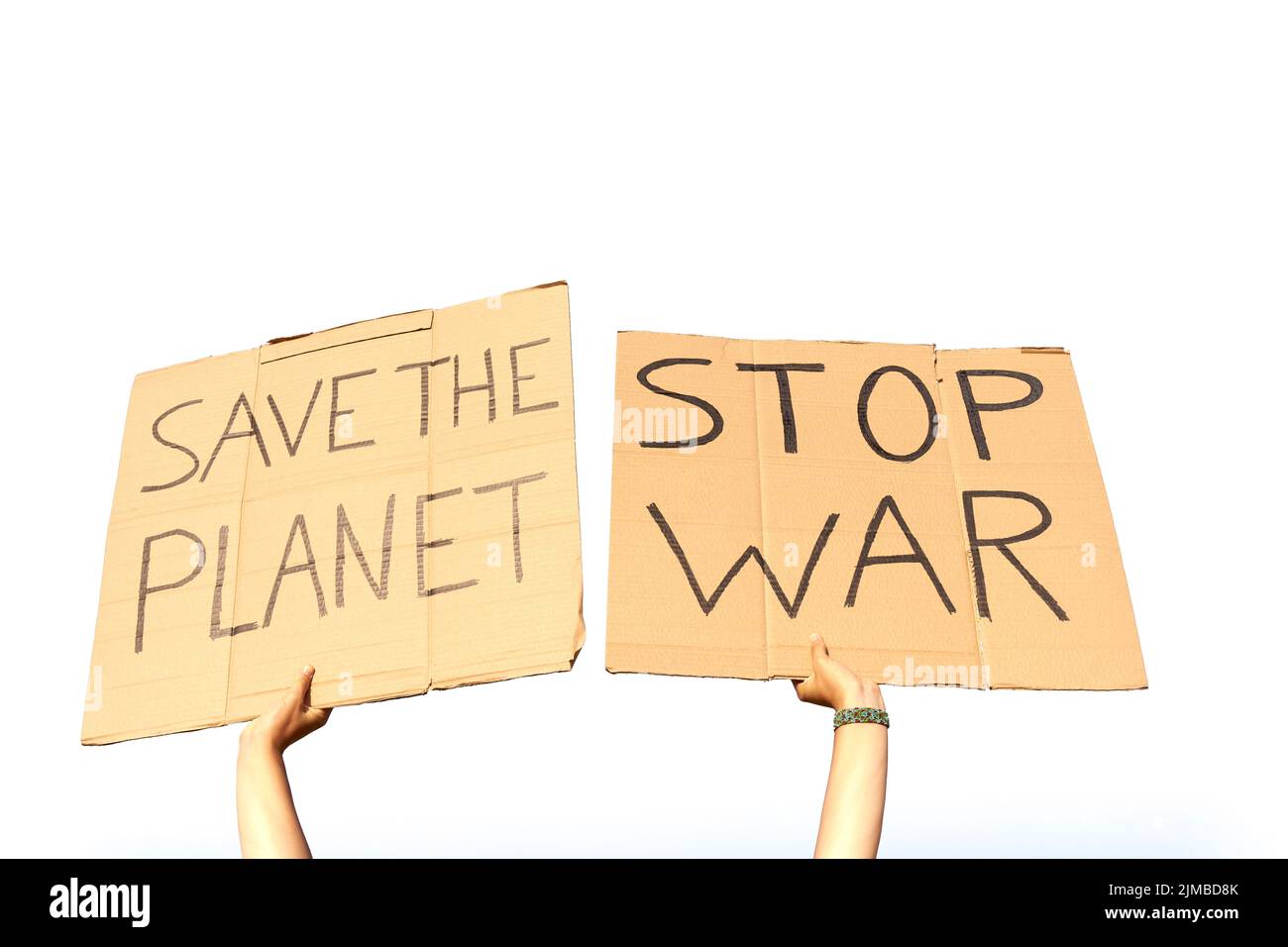 Two Cardboard Signs saying Save the planet and Stop War held by hands ...