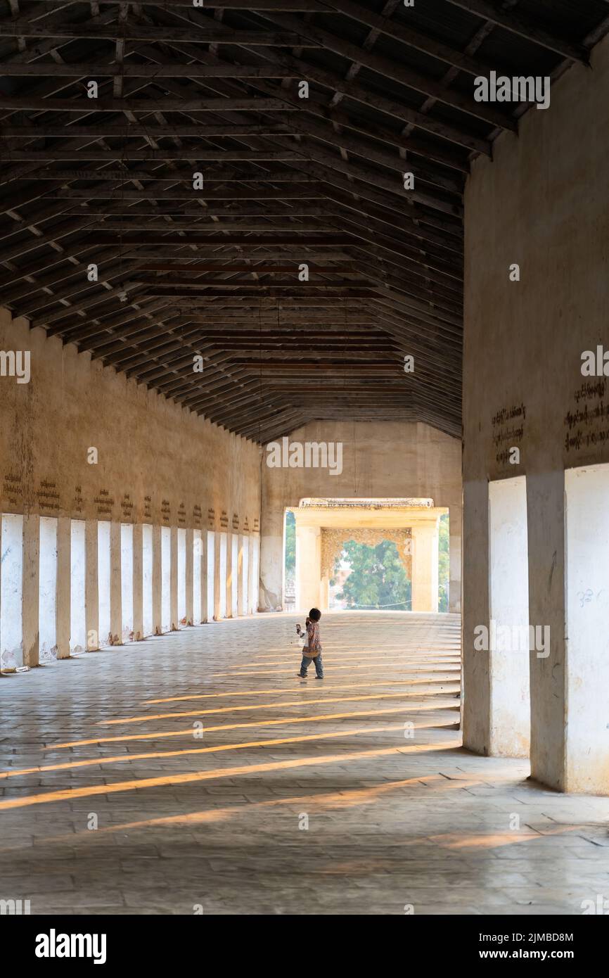 A kid walking through Shwezigon Pagoda Entrance in Bagan, Myanmar ...