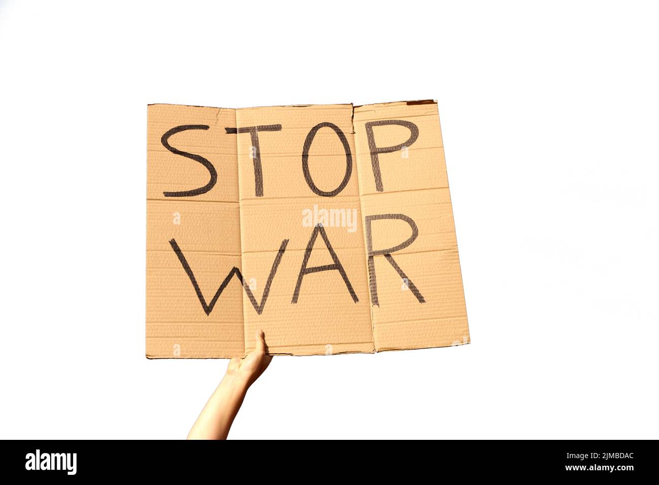A Cardboard Signs saying Stop War held by hands on a white background ...