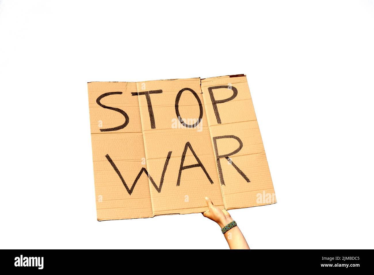 A Cardboard Signs saying Stop War held by hands on a white background ...