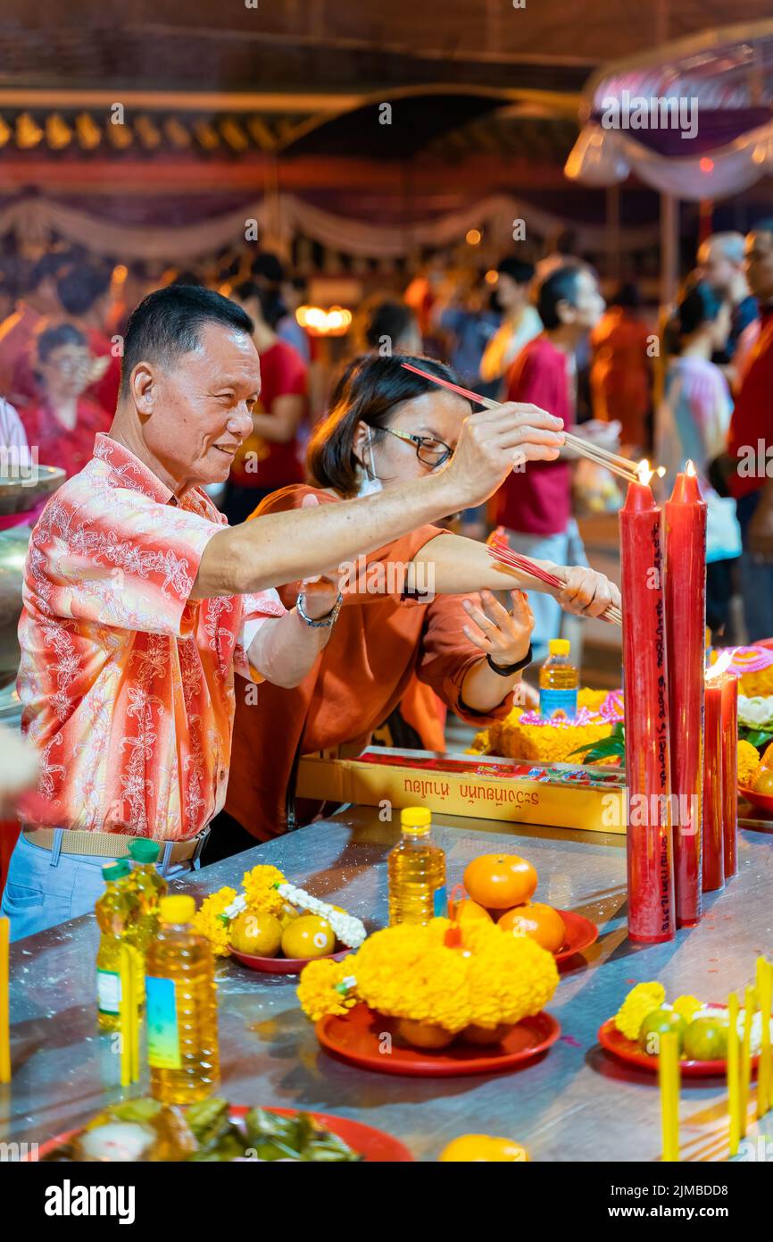 A group of people praying and celebrating the Chinese New Year, Bangkok ...