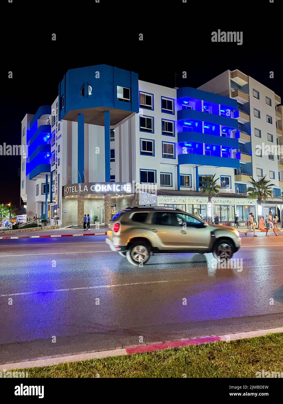 The exterior of hotel La Corniche in Fnideq at night Stock Photo - Alamy