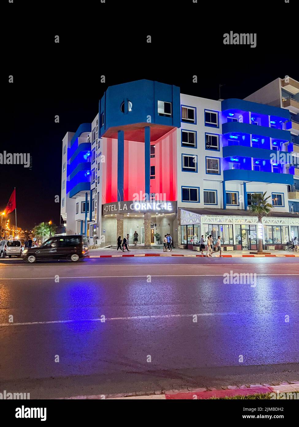 The exterior of hotel La Corniche in Fnideq at night Stock Photo - Alamy