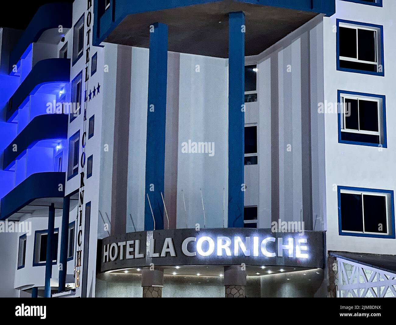 The exterior of hotel La Corniche in Fnideq at night Stock Photo - Alamy