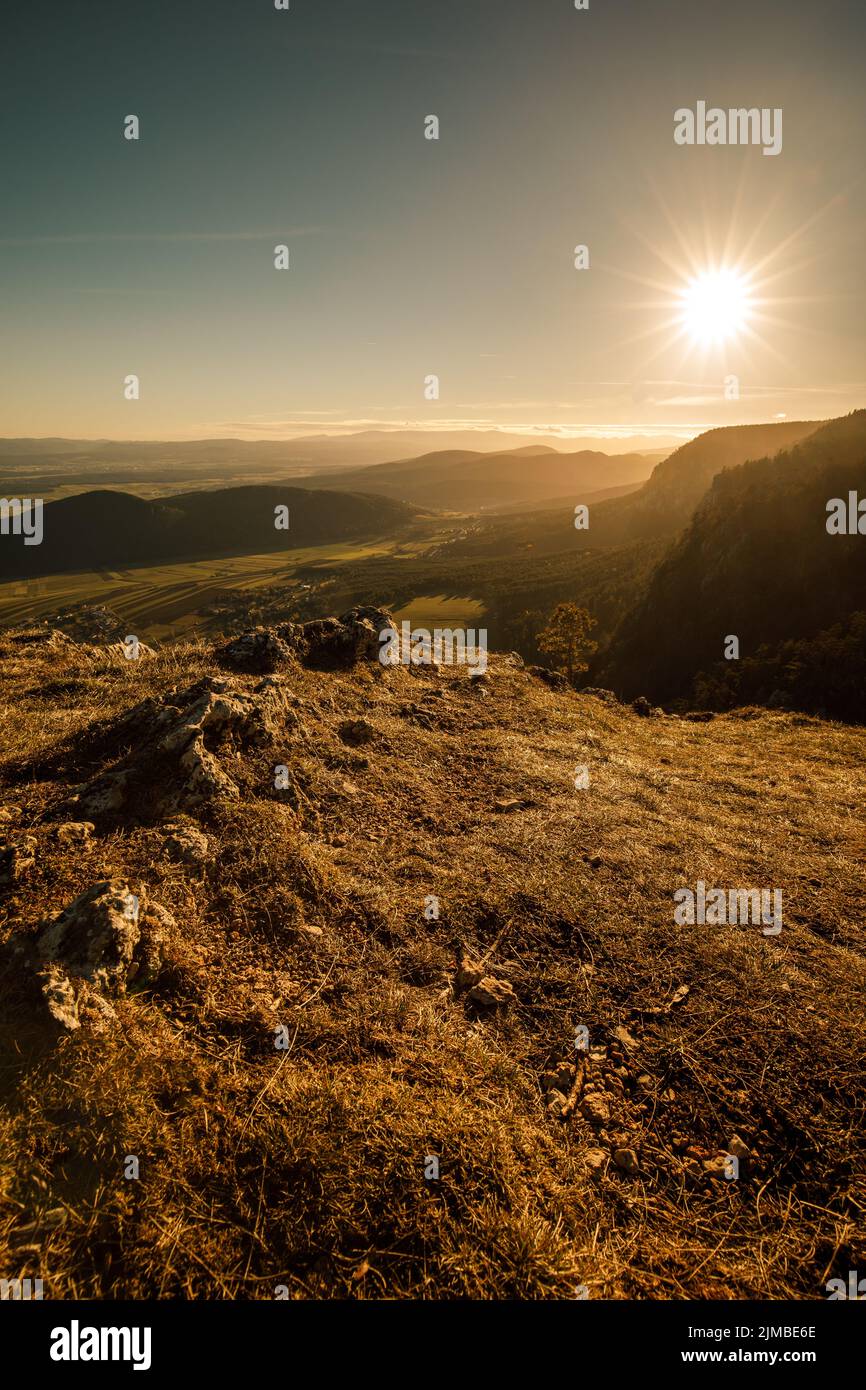 Great mountain peak with sun Stock Photo - Alamy