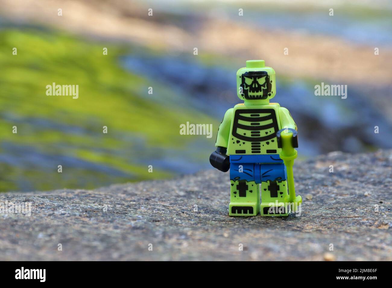 Toy character, green zombie walking outdoors during an apocalypse Stock ...