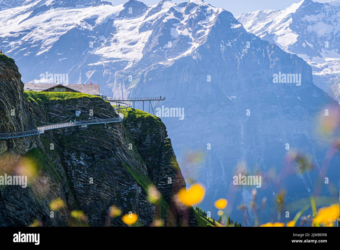 A distant view of the First Cliff Walk on a rocky mountainside in ...