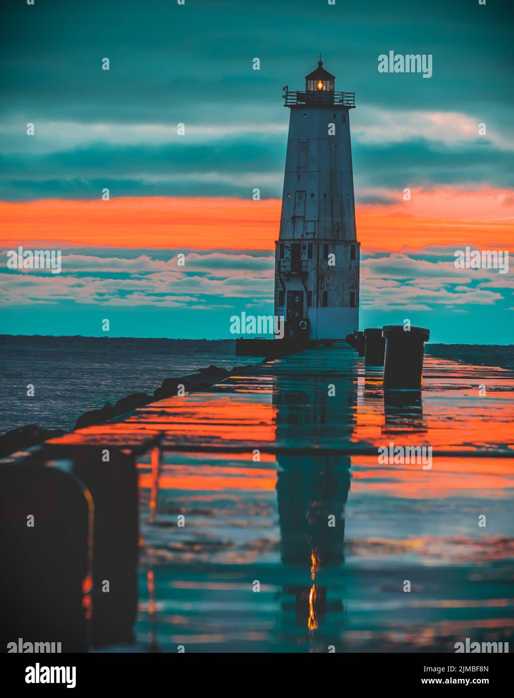 Touch of Sun Between Storm and Clouds, Michigan Lighthouse Stock Photo ...