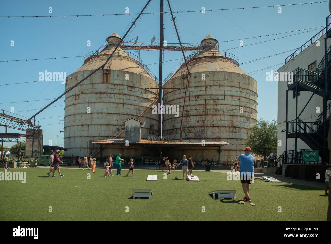 People enjoying the day at magnolia silos Waco Texas during a clear sky ...