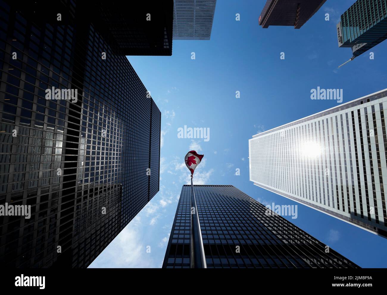 The Bay Street Financial District is shown with the Canadian flag in ...