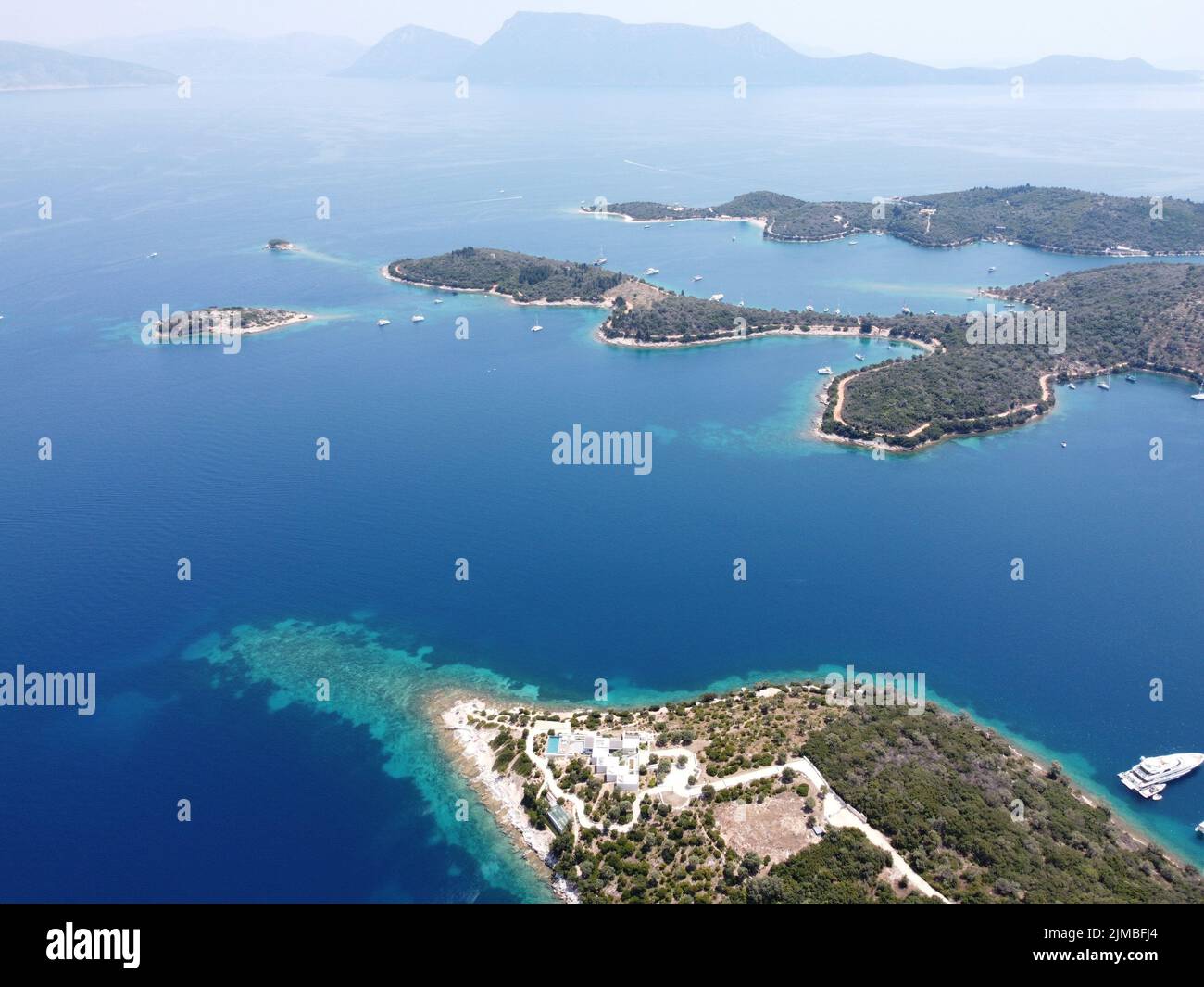 An aerial view of lush green islands in blue ocean Stock Photo - Alamy