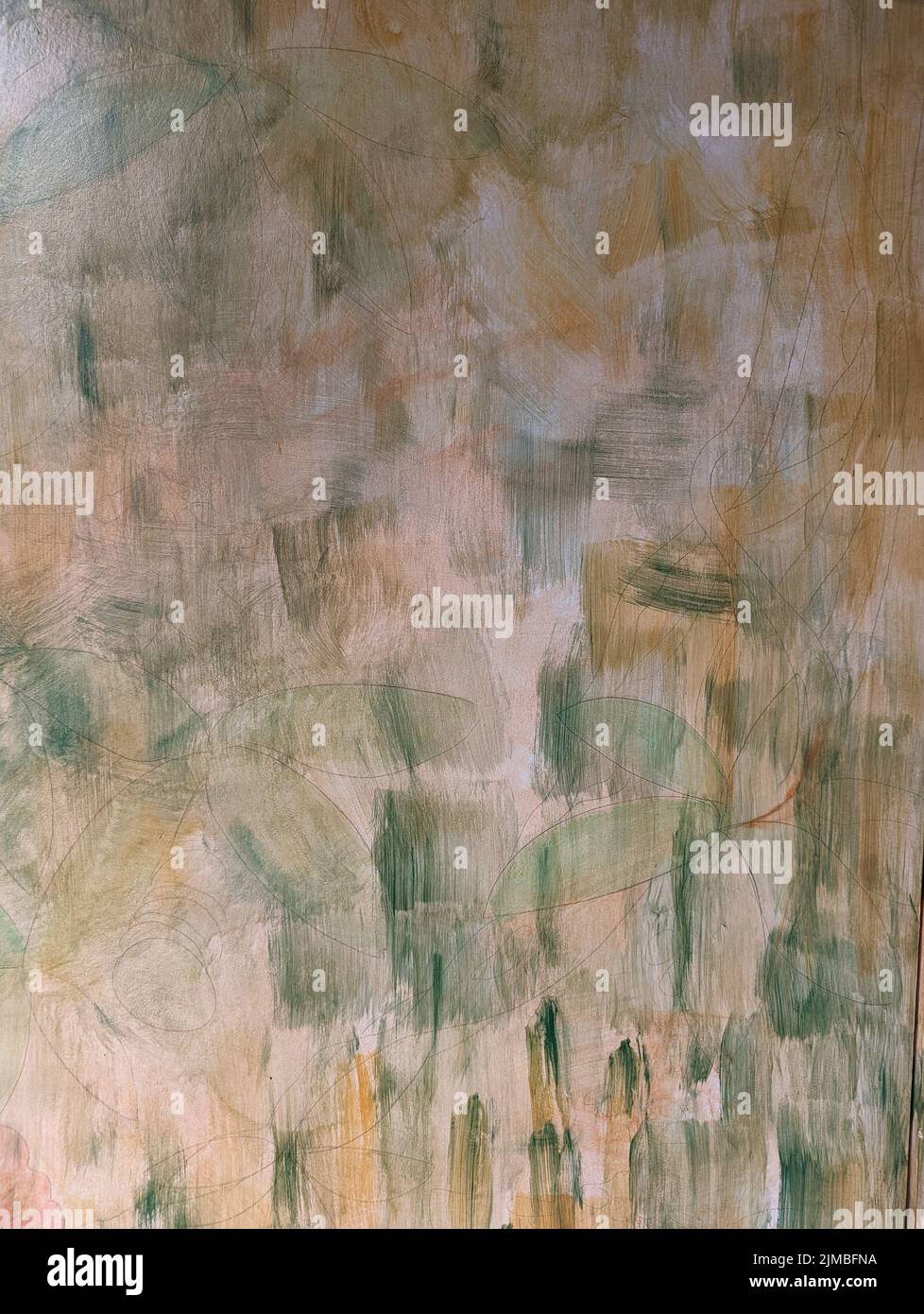 A vertical shot of a wooden board painted in green and white with half ...