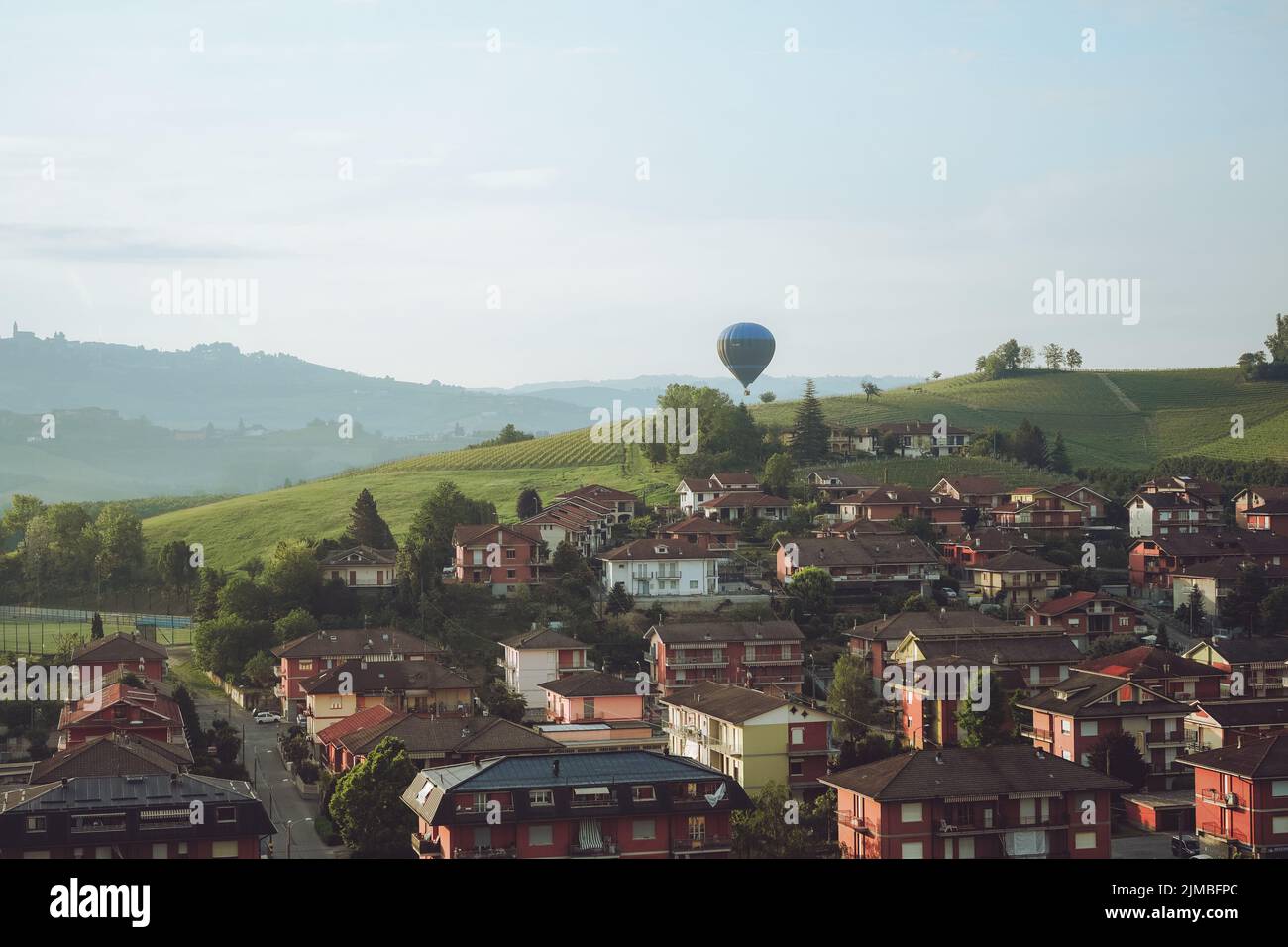 An aerial view of the small town of Barolo in Italy with a hot-air ...