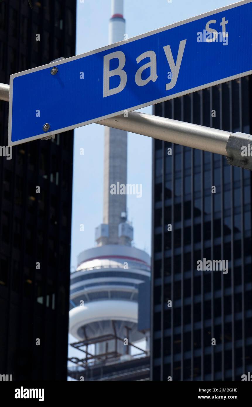 The Bay Street Financial District is shown next to the CN Tower in ...
