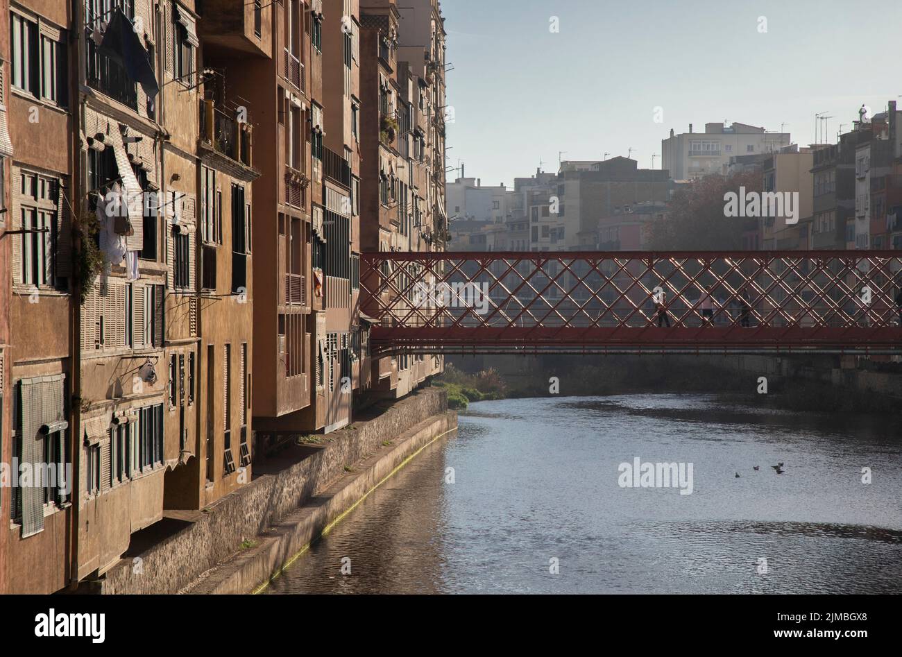 An exterior view of residential building blocks and metal bridge above ...