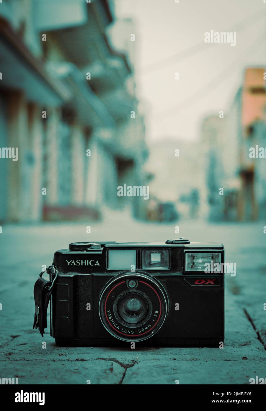 An old vintage camera on the ground with building background Stock ...