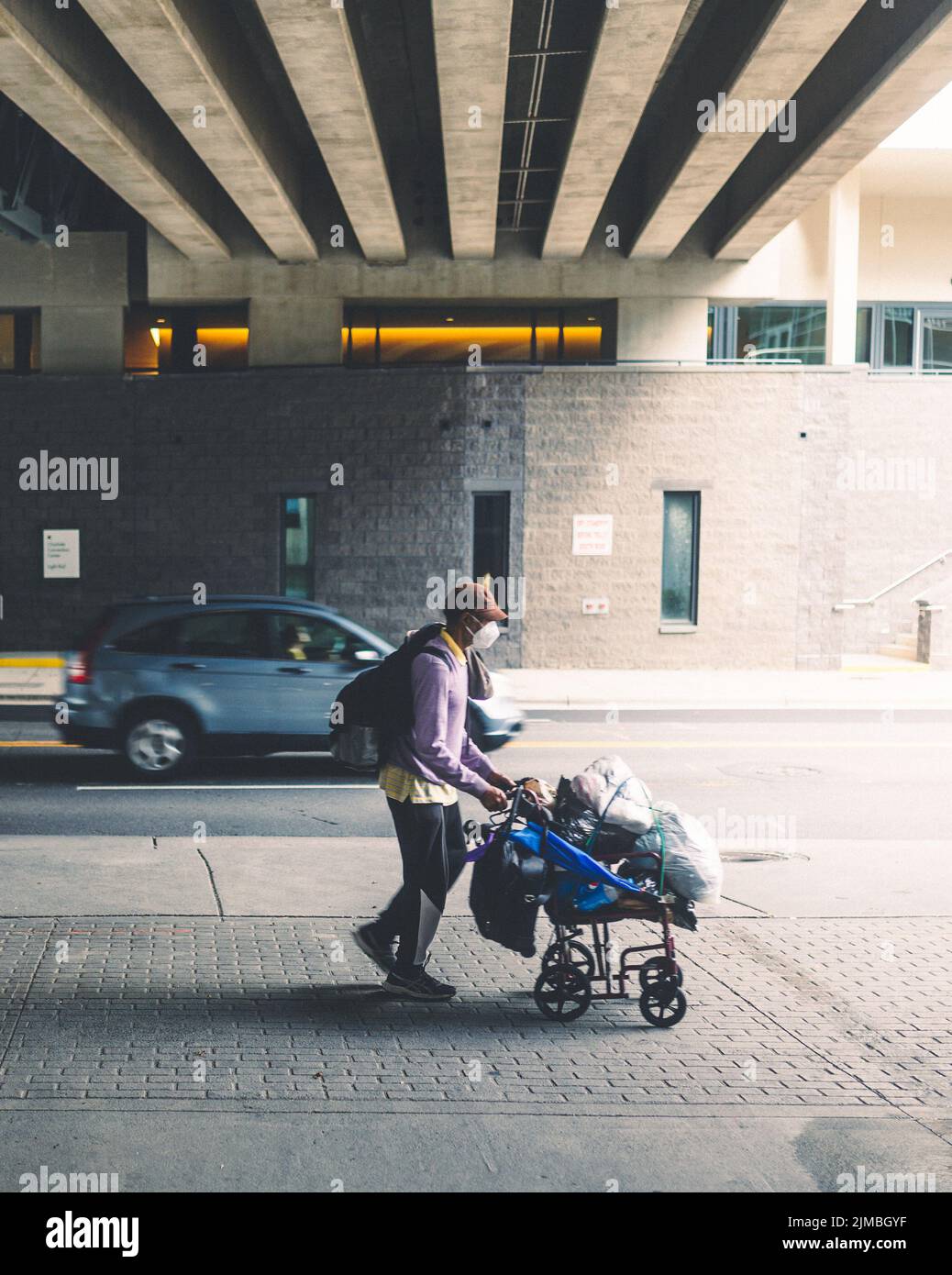 Man pushing cart on road hi-res stock photography and images - Alamy